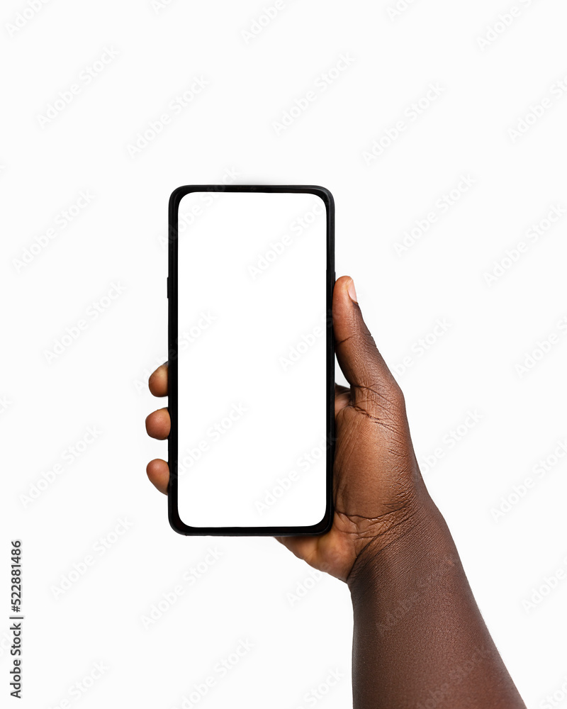 Black hand holding phone facing camera isolated on white background ...