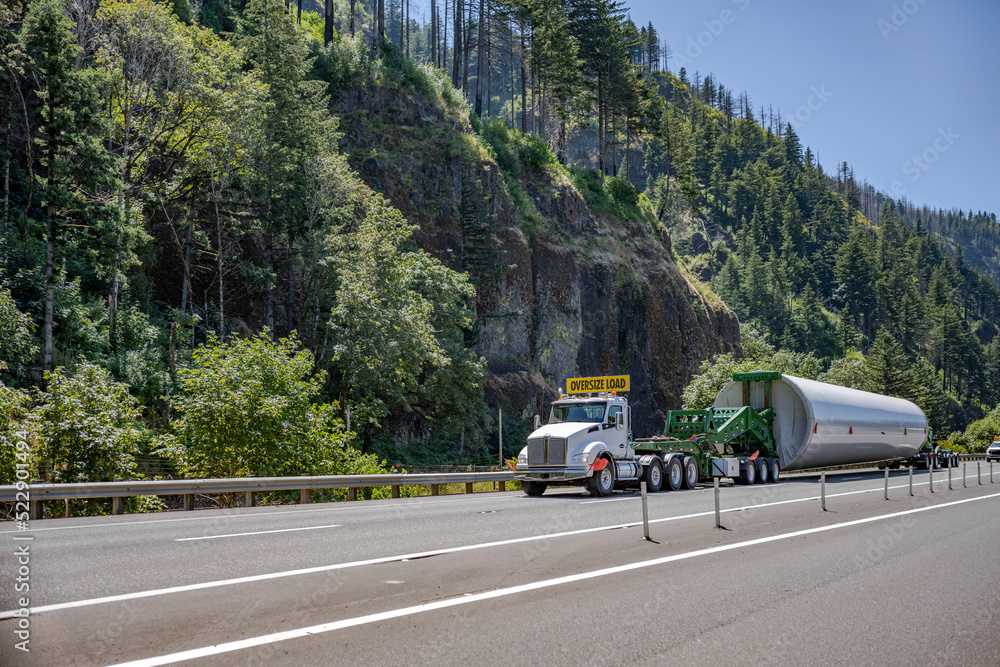 Powerful big rig semi truck tractor with oversize load sign ...