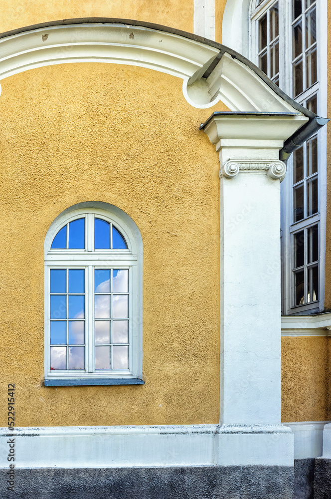 Yellow wall architecture facade with arched window Stock Photo | Adobe ...