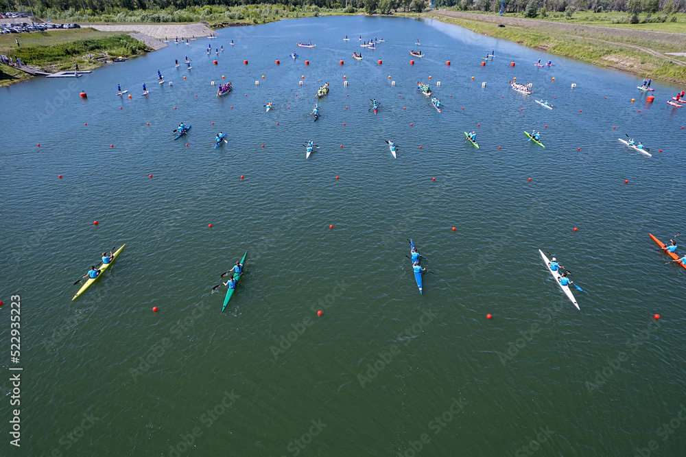 training of rowers on kayaks and canoes on rowing channel. top view ...