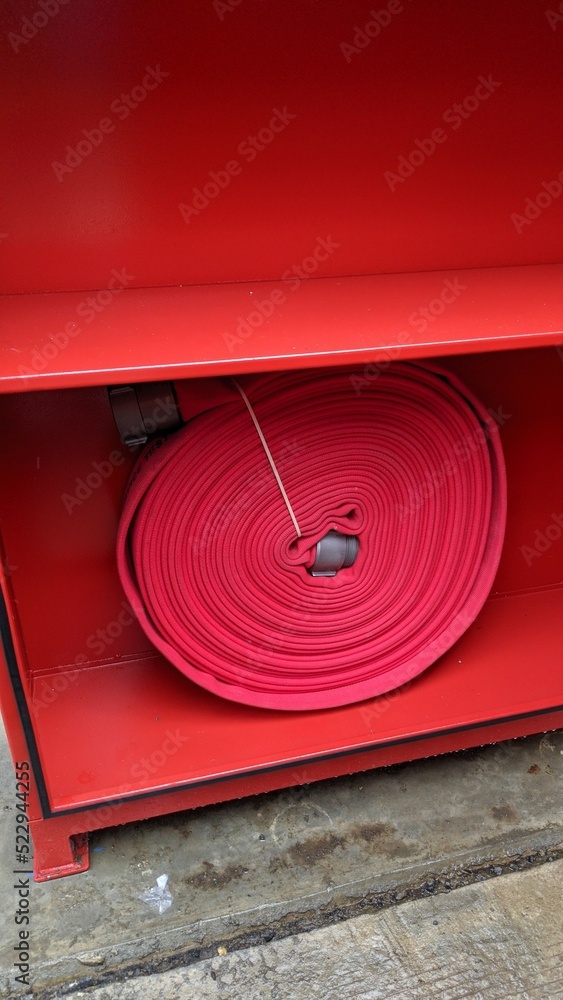 1 roll red hose hydrant on the emergency fire box. The photo perfect ...