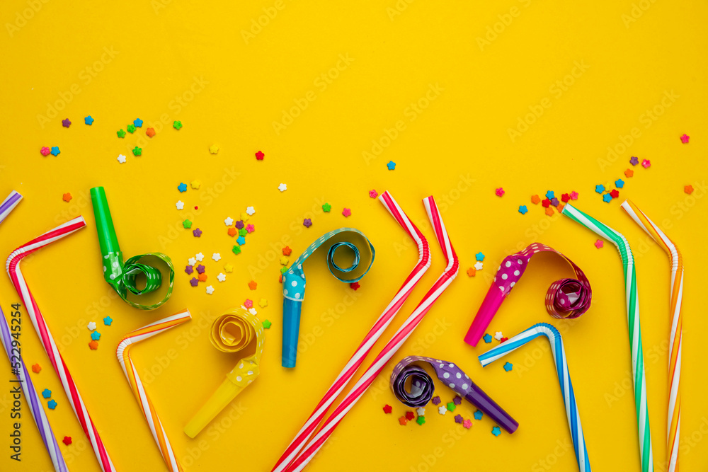 Abstract colored party background. Multi-colored party horns ...