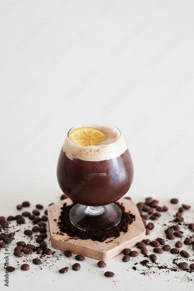 Short wine glass of Honey lemon americano shake top with yellow ,sour ...