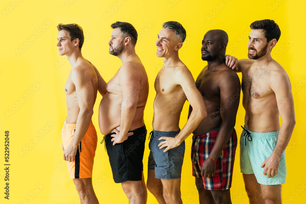 group of multiethnic men posing for a male edition body positive beauty ...