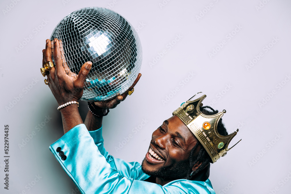 artistic portrait with gel lights. Handsome man posing on colored ...