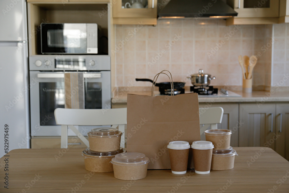 Bunch of blank disposable containers for takeout food stacked with ...