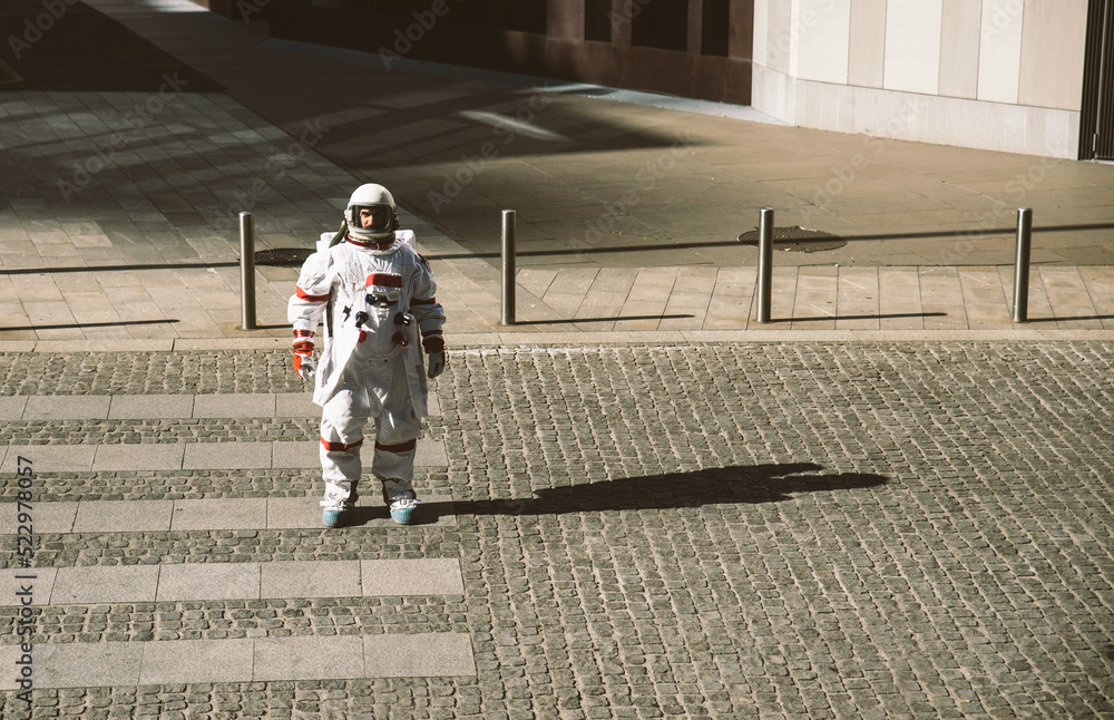 spaceman in a futuristic station. Man with space suit walking in an ...