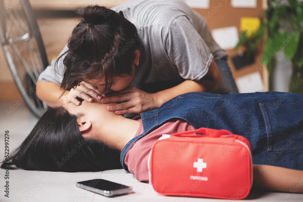 First aids emergency mounted CPR on heart attack woman laying ...