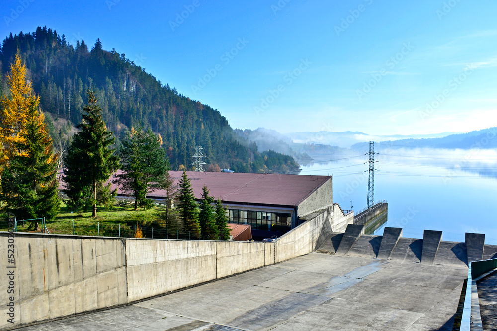 Water overflow in the dam. Opened water dam. Dam and water reservoir in ...