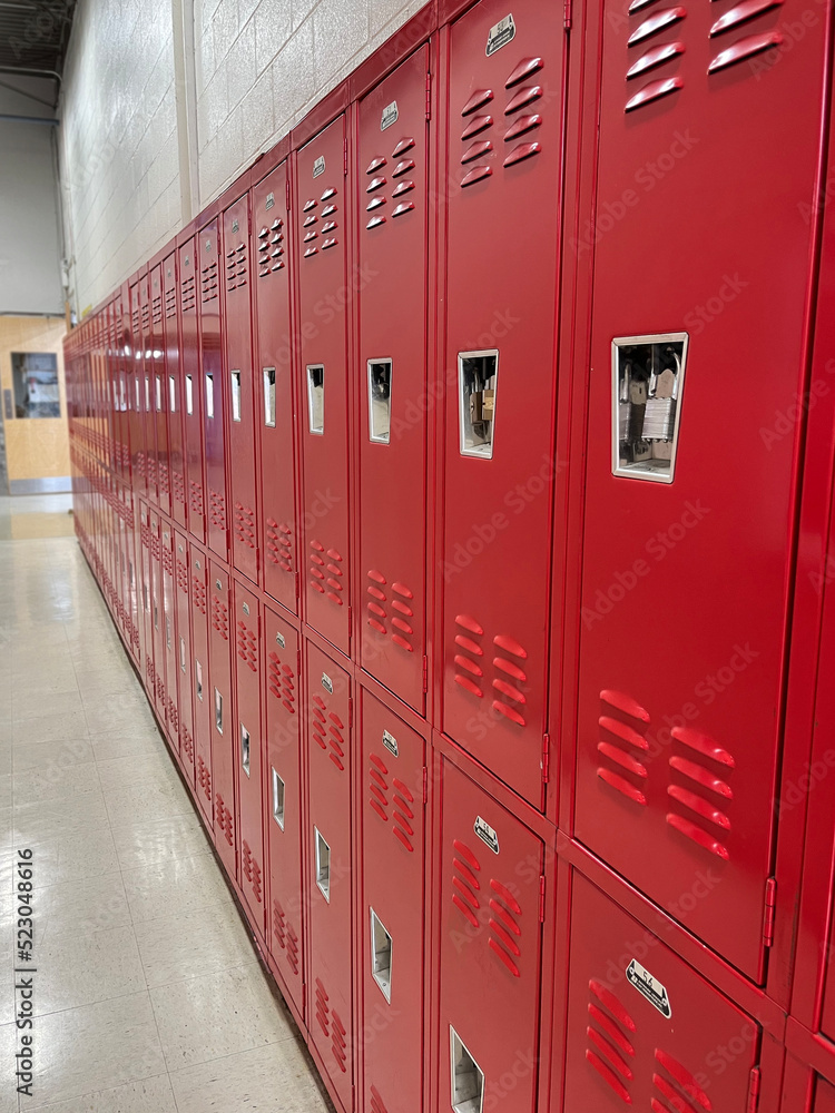 Wall of red lockers in workplace or school for storage perspective ...