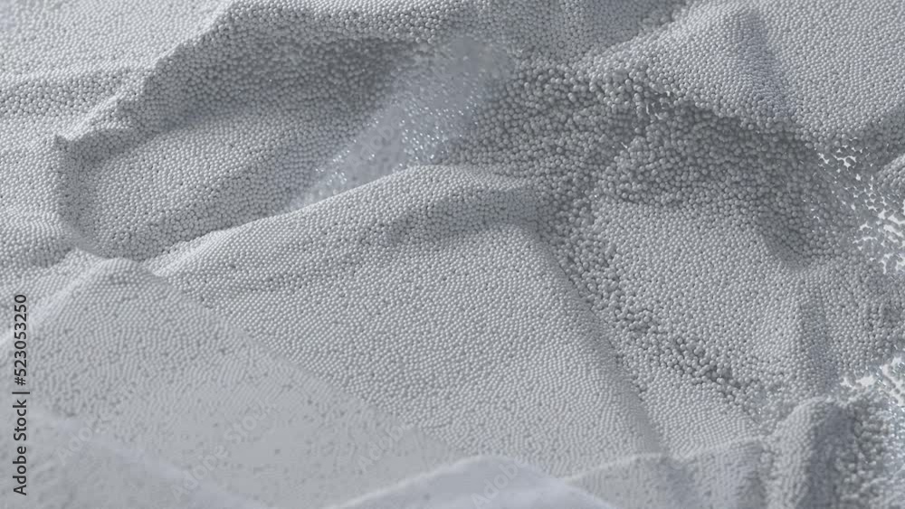 Small white particles pulsate and flow, creating abstract shapes ...