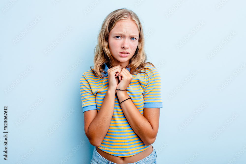 Caucasian teen girl isolated on blue background scared and afraid. Stock Photo | Adobe Stock