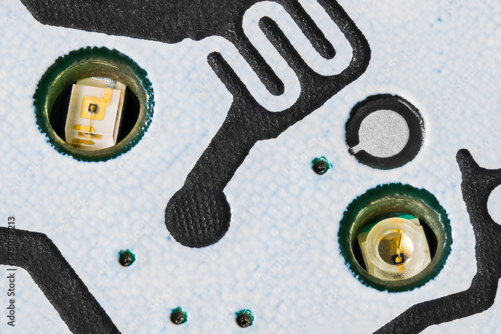 Closeup of small LED diodes inside white printed circuit board ...
