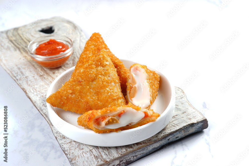 Triangle Fried Risoles or Risol mayo is a typical Indonesian ...
