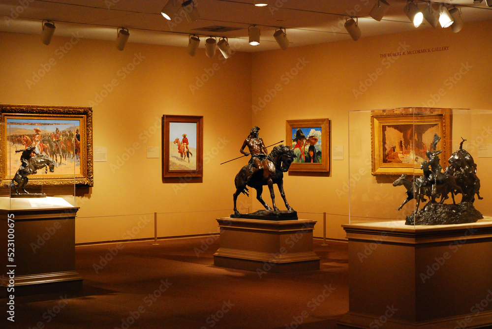 Western and native themed art fill up a museum gallery in the American ...