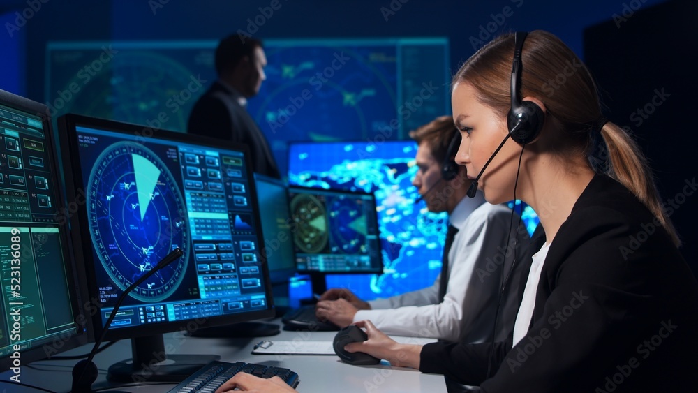 Workplace of the air traffic controllers in the control tower. Team of ...