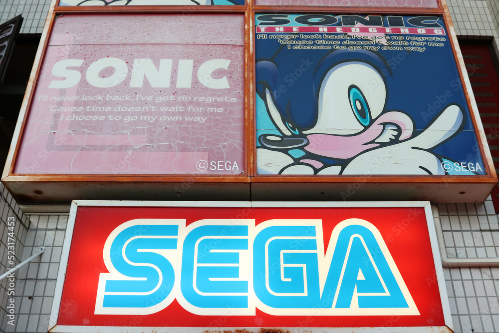 TOKYO, JAPAN - February 6, 2021: Signs above an entrance to a Sega ...