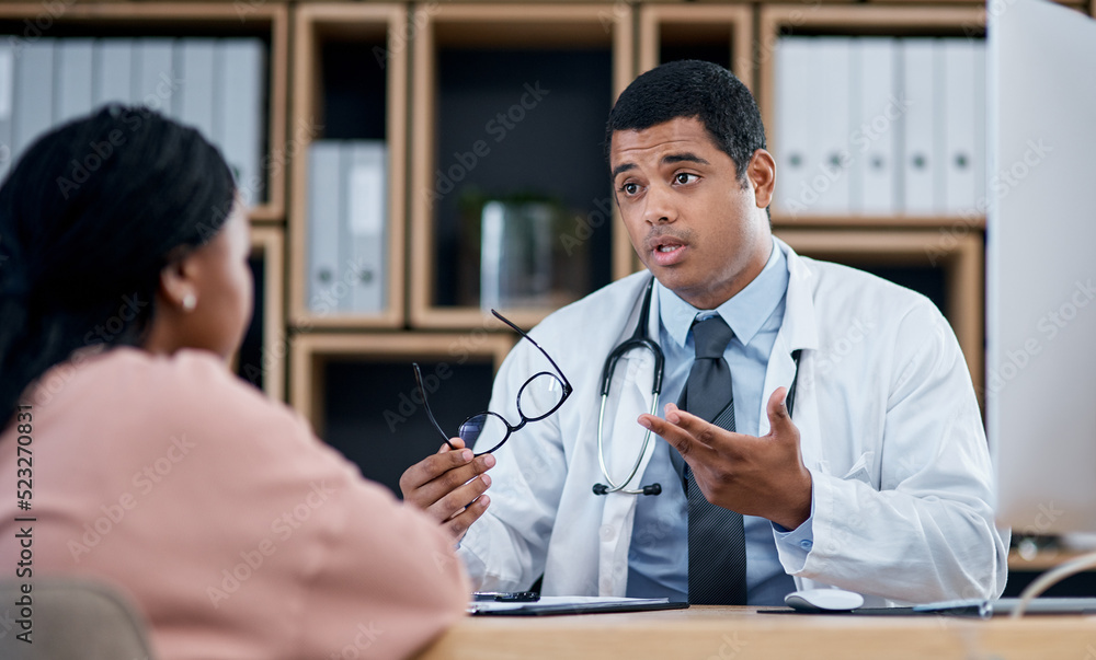 Doctor talking to patient in medical consultation, checkup and visit in ...