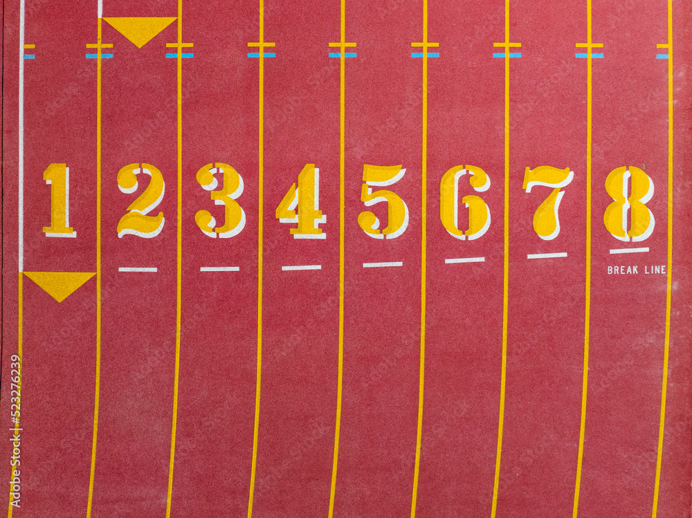 Aerial image of a new red running track lane numbers, 1 through 8, with ...