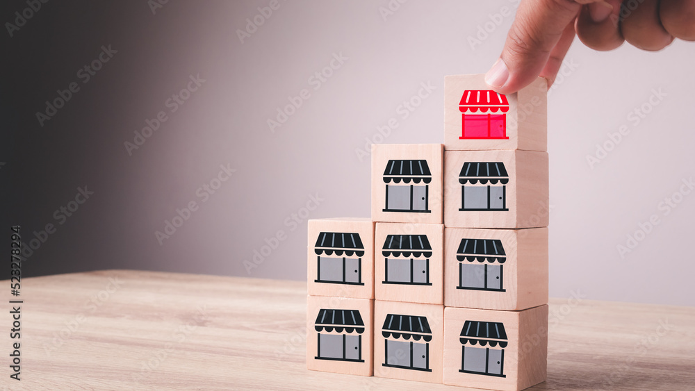 Close-up hand choose stack cube wooden blocks place in line up with ...