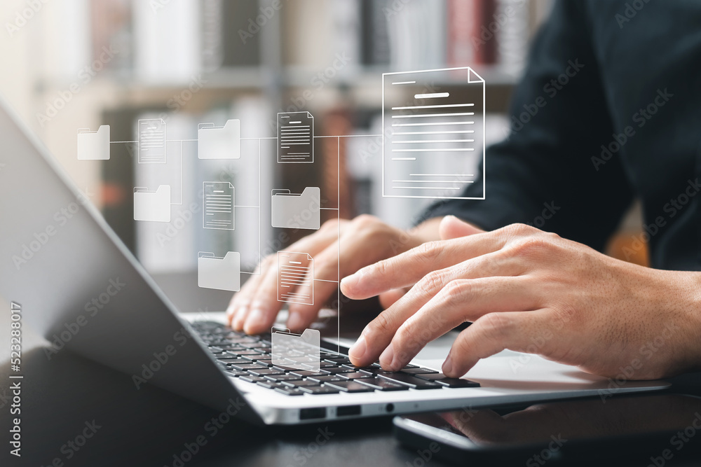 Document management system concept, businessman using laptop manage ...
