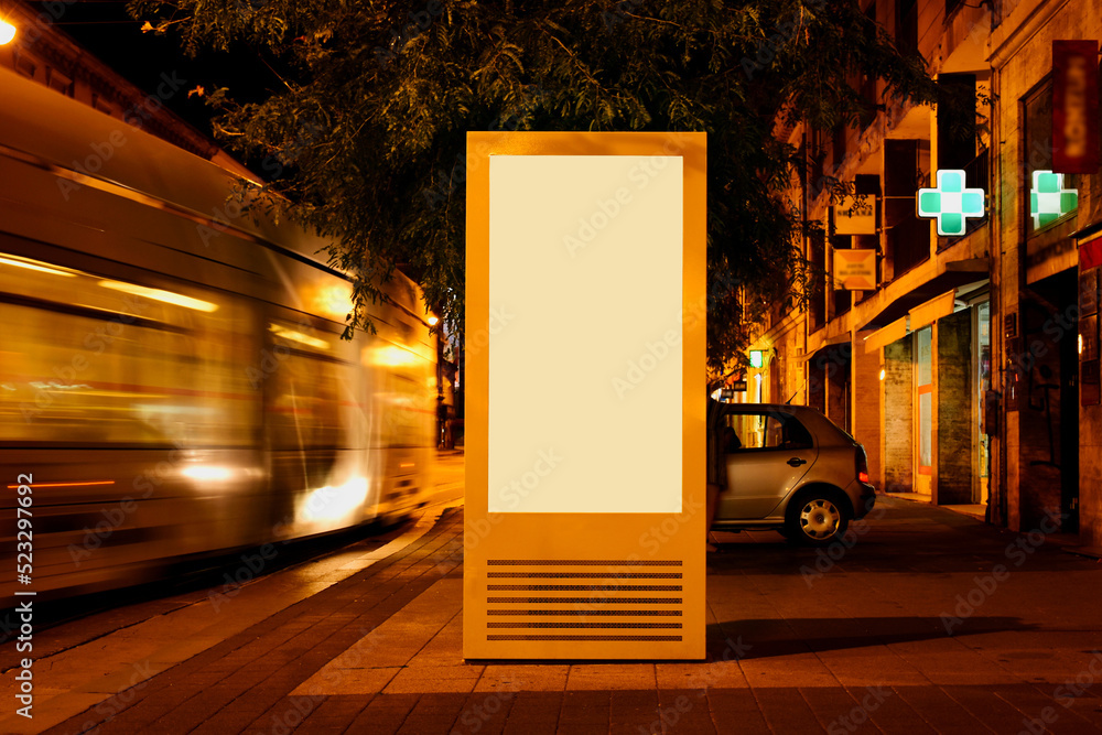 advertising, ad, commercial billboard and lightbox at a tram stop with ...