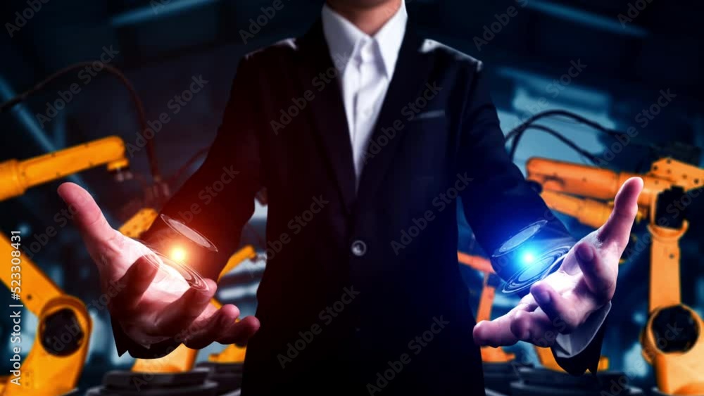 Engineer use cybernated robotic software to control industry robot arm ...