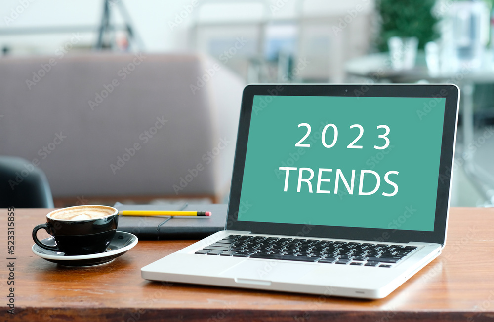 Laptop computer with 2023 trends on screen background, digital ...