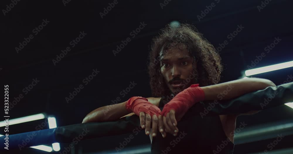 exhausted african fighter is resting after hard match, workout on ...