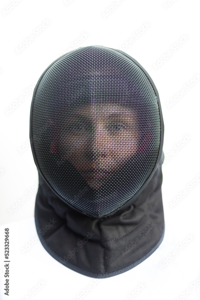 Closeup of black metal mask (helmet) on female full face head for ...