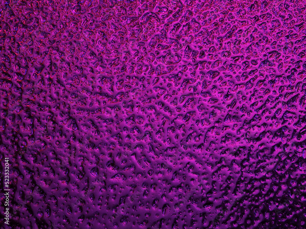 Bright purple winter background. The surface of ice frozen on the ...