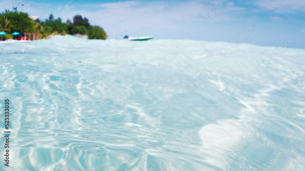 Tropical blue sea with island. Splitted view of the tropical island and ...
