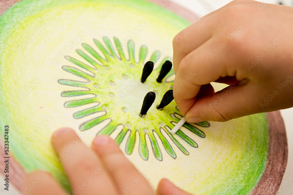 Slice of Kiwi fruit. DIY home made paper toy. Seeds made of black ...