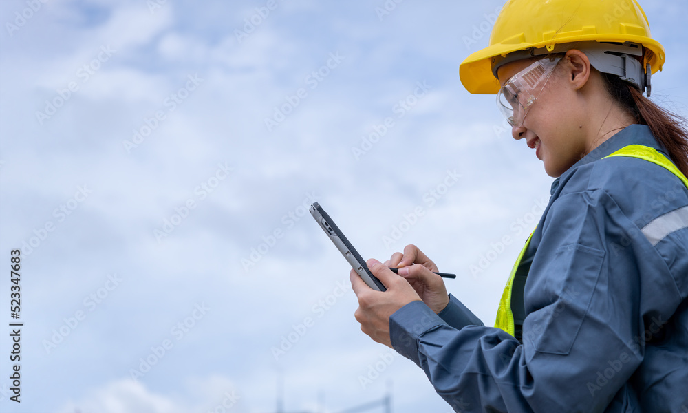 Engineer wearing uniform ,helmet and glass stand hand holding detail ...