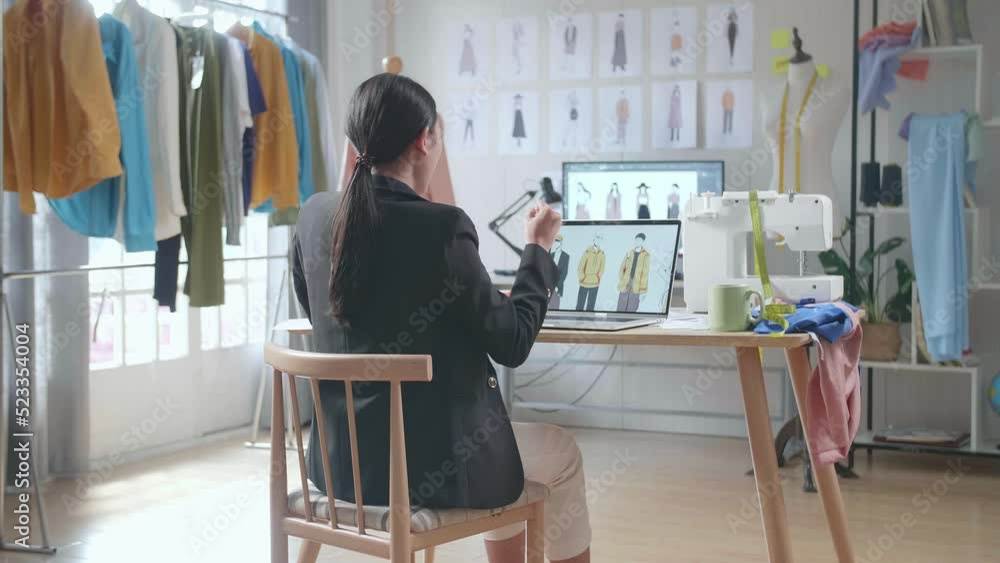 Back View Of Asian Female Designer In Business Suit Celebrating While ...