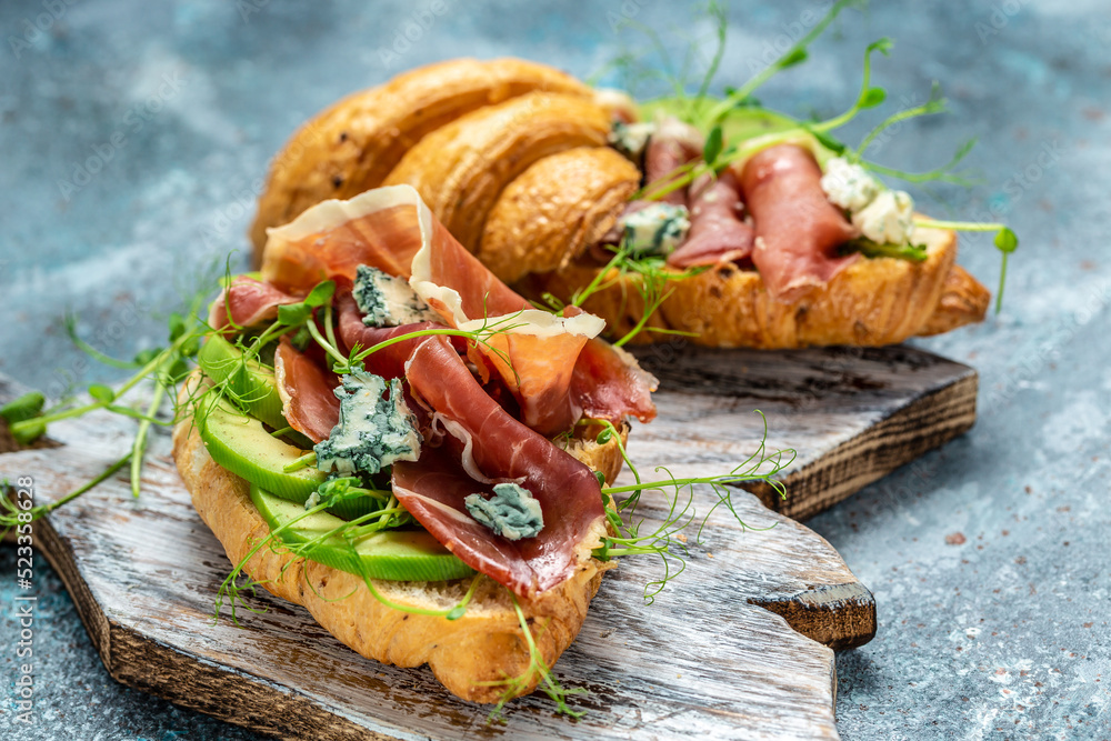 Croissant sandwiches with jamon ham serrano paleta iberica, blue cheese ...