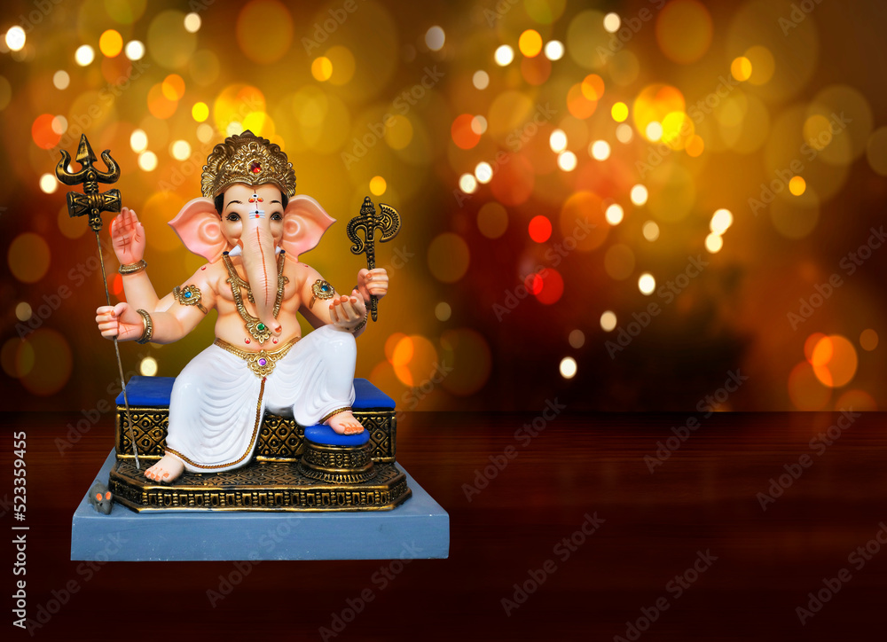 Hindu God Ganesha on colourful bokhe background, Ganesha Idol. Ganesh ...