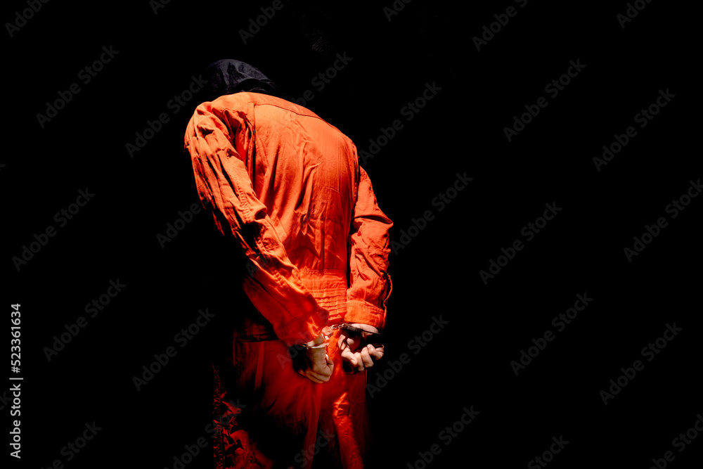 Handcuffs on Accused Criminal in Orange Jail Jumpsuit. Law Offender ...