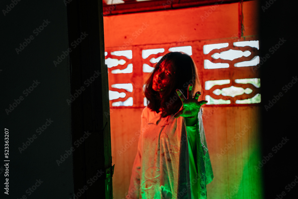 Ghost, zombie, demon A woman dressed up as a ghost in a bloody ...