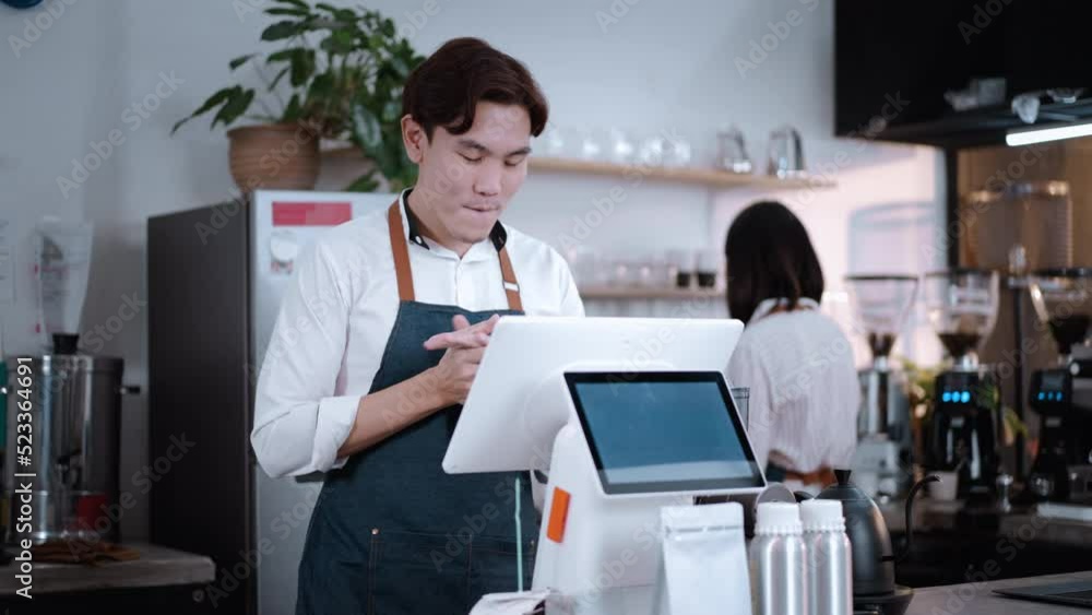 Asian cafe business male owner checking report sales on computer laptop ...