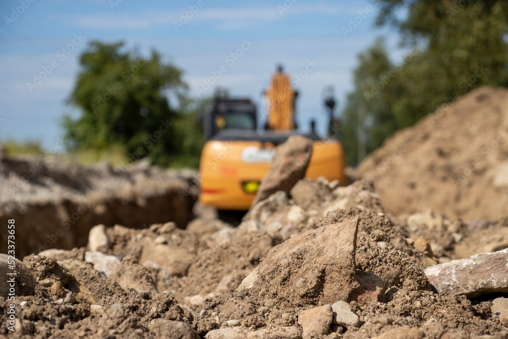 Limestone- Lime stone trench. Construction site. CRAWLER EXCAVATOR ...