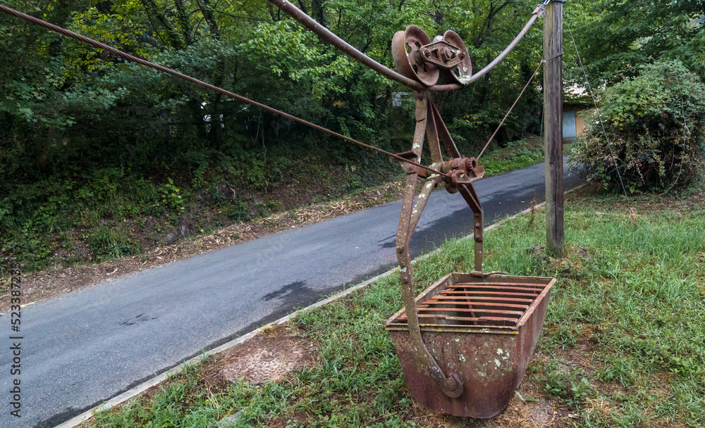 reproduction of a wagon, hopper in the mine with pulley on wire rope ...