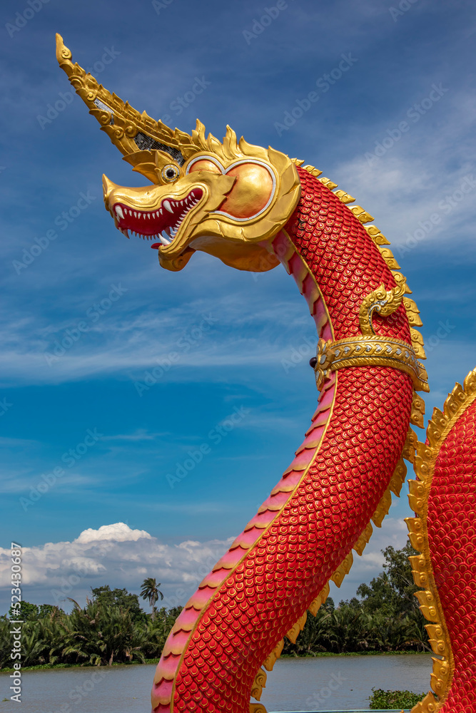 the gigantic Phaya Nak statue in Wat Saman Rattanaram in Chachoengsao ...