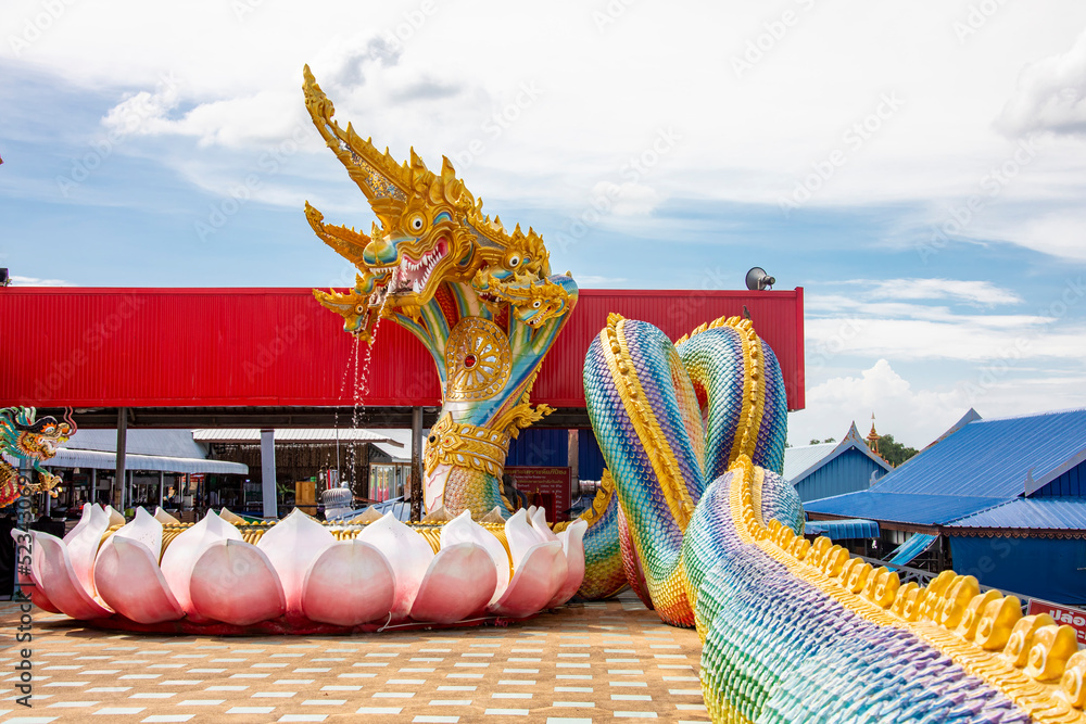 the gigantic Phaya Nak statue in Wat Saman Rattanaram in Chachoengsao ...