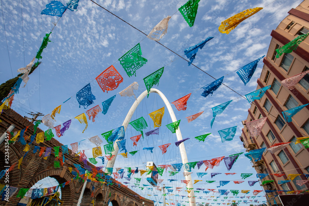 Poster Daytime papel picado framed view of the iconic landmark arch of ...