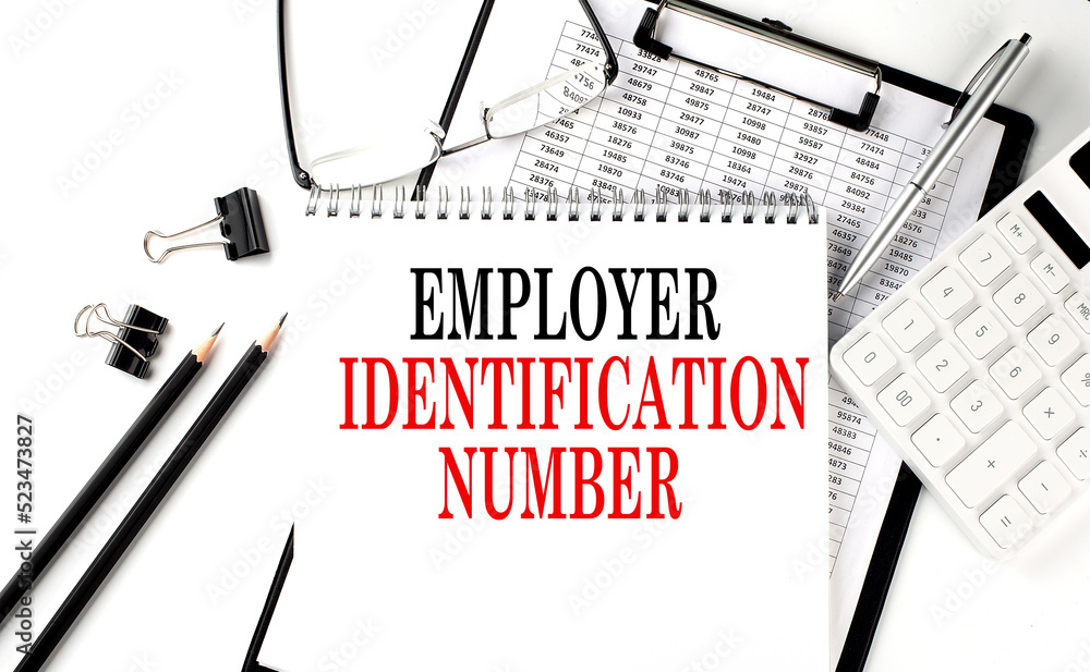 EIN - Employer Identification Number word on notepad with clipboard ...