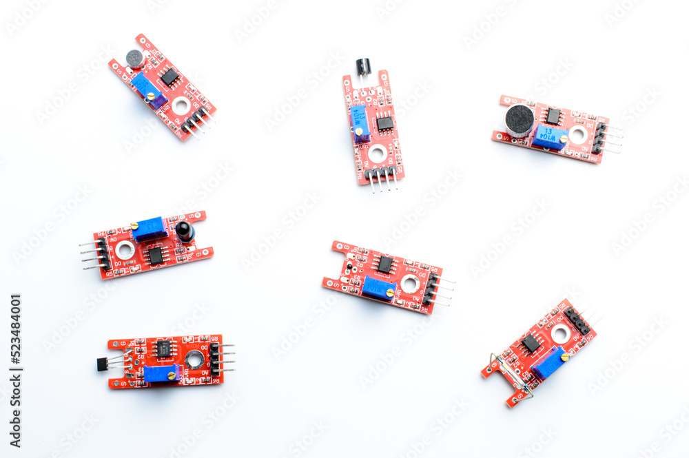 Arduino DIY modules on a white background. Selective focus. Red PCB ...