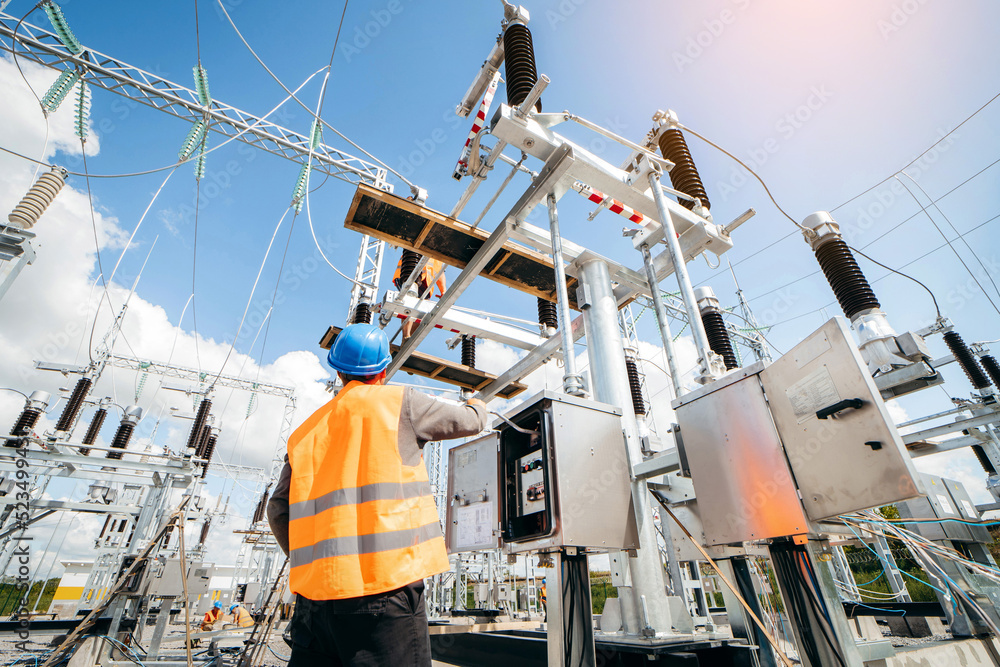 Adult electrical engineer inspect the electrical systems at the ...