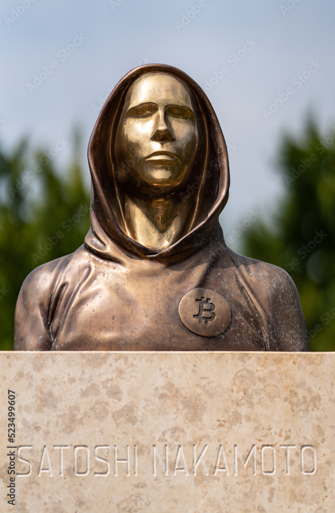 Portrait of the statue of Satoshi Nakamoto mysterious founder of Bitcoin Stock Photo | Adobe Stock