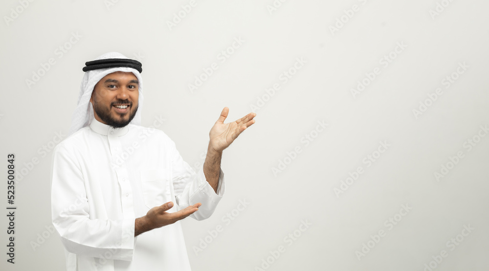 Portrait of arabic man with kandura dress on isolated white background ...